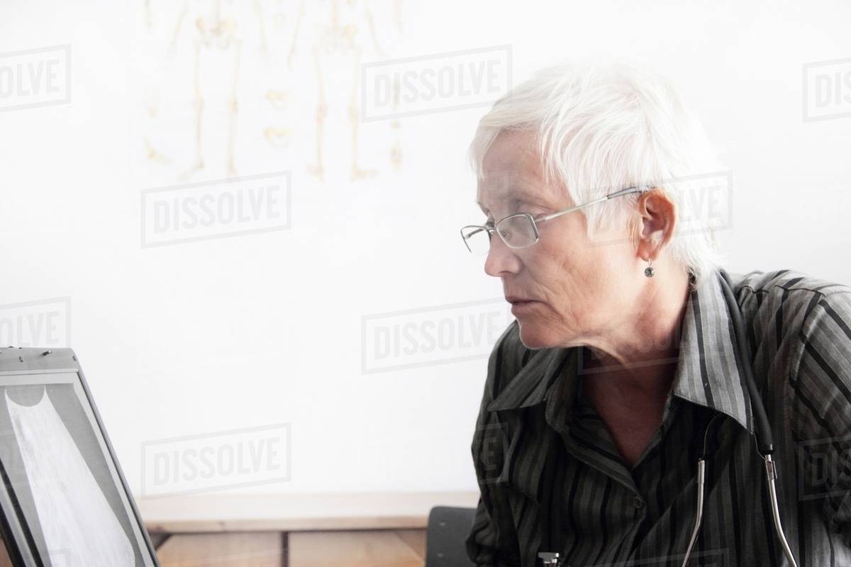 Doctor using computer in office - Royalty-free Stock Photo | Dissolve