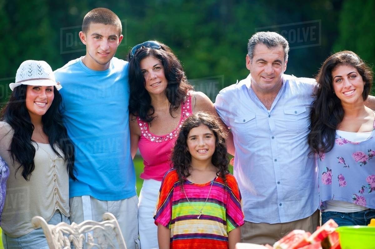 Family standing together outdoors - Royalty-free Stock Photo | Dissolve