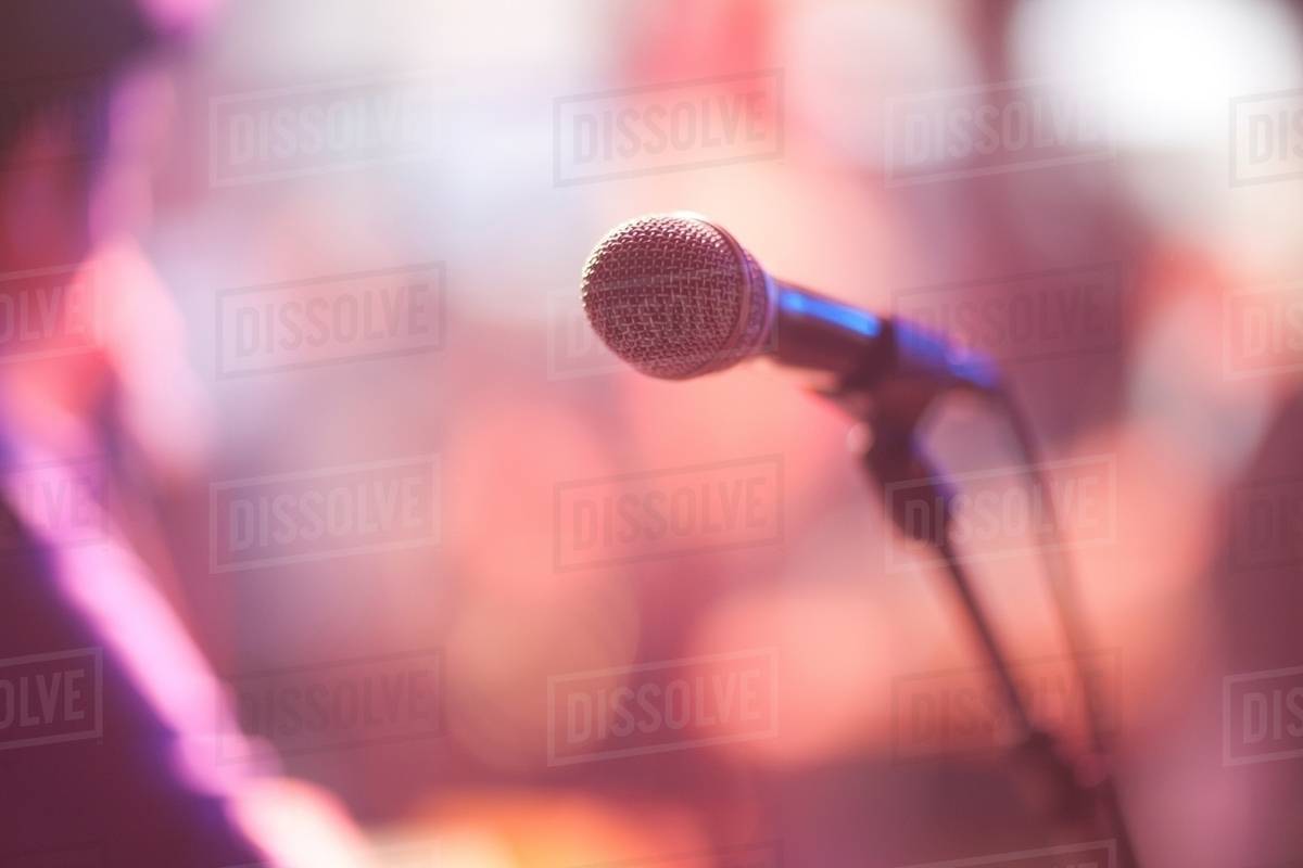 Close up of microphone on stage - Royalty-free Stock Photo | Dissolve
