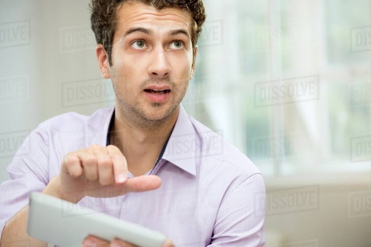 Young man explaining with digital tablet - Royalty-free Stock Photo ...