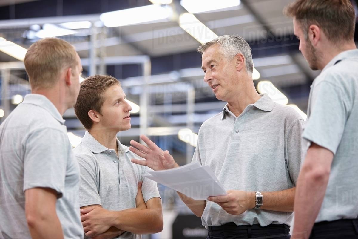Manager and workers meeting in engineering factory - Royalty-free Stock ...