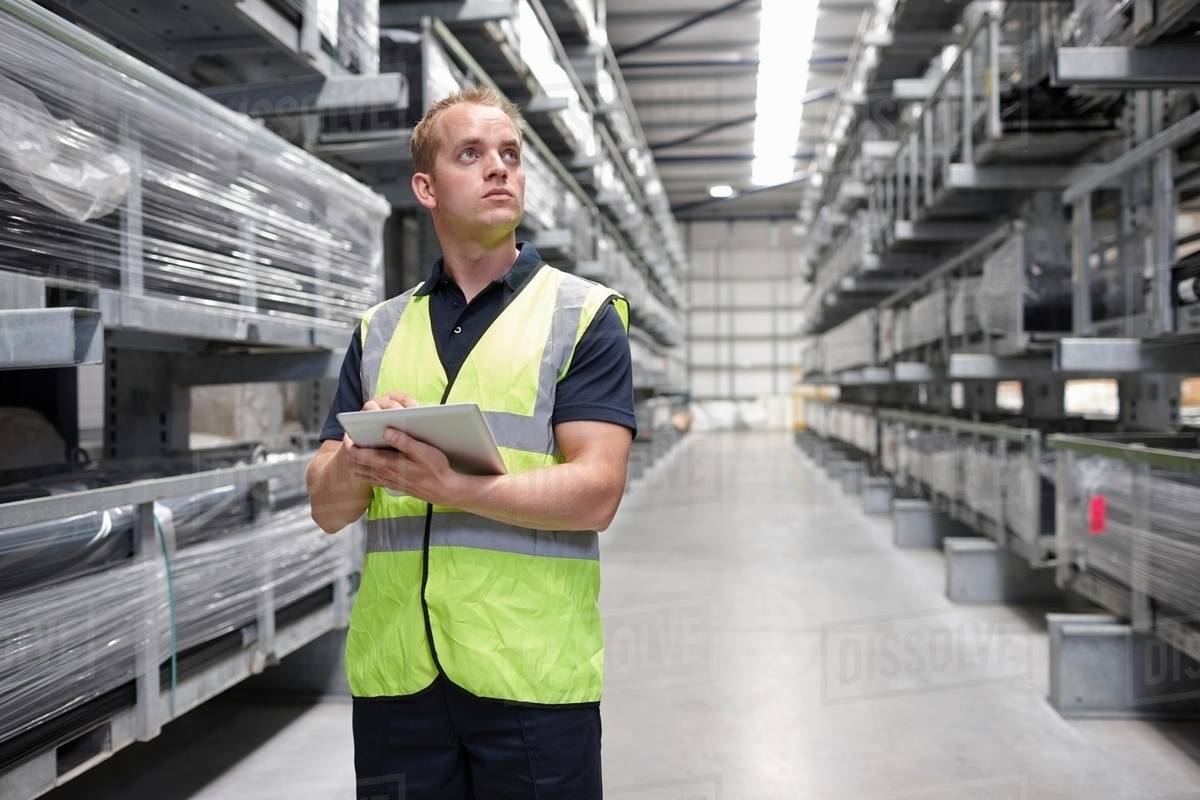 Worker checking order in engineering warehouse - Royalty-free Stock ...