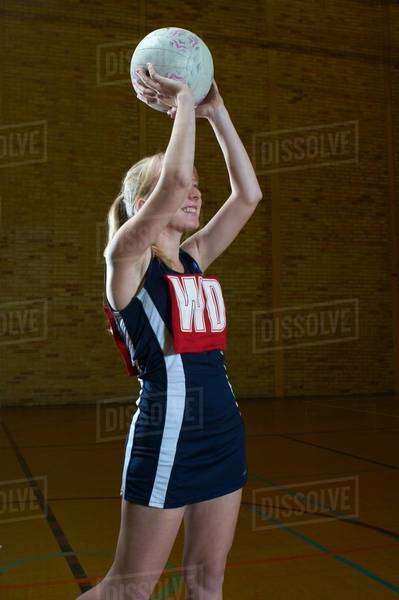 Portrait of netball player holding ball - Royalty-free Stock Photo ...