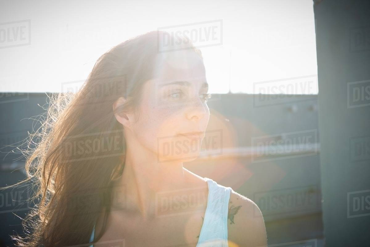 Portrait of young woman looking away - Royalty-free Stock Photo | Dissolve