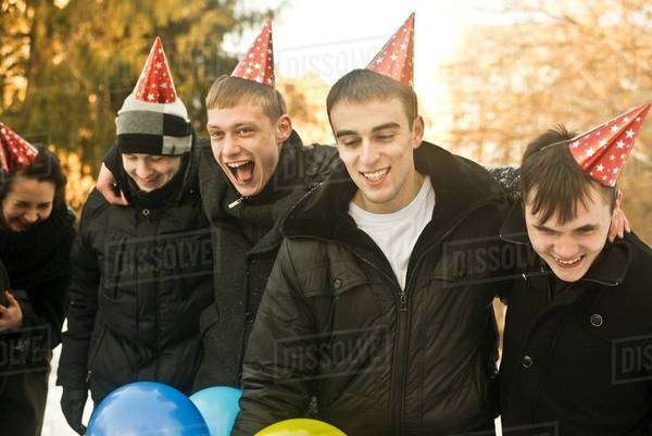 Group of young friends with wearing party hats - Royalty-free Stock ...