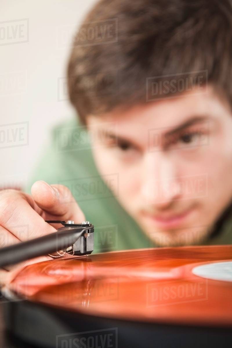 Young man playing vinyl record, close up - Royalty-free Stock Photo ...