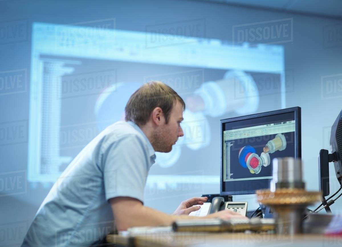 Engineer using computer aided design in factory office - Stock Photo ...
