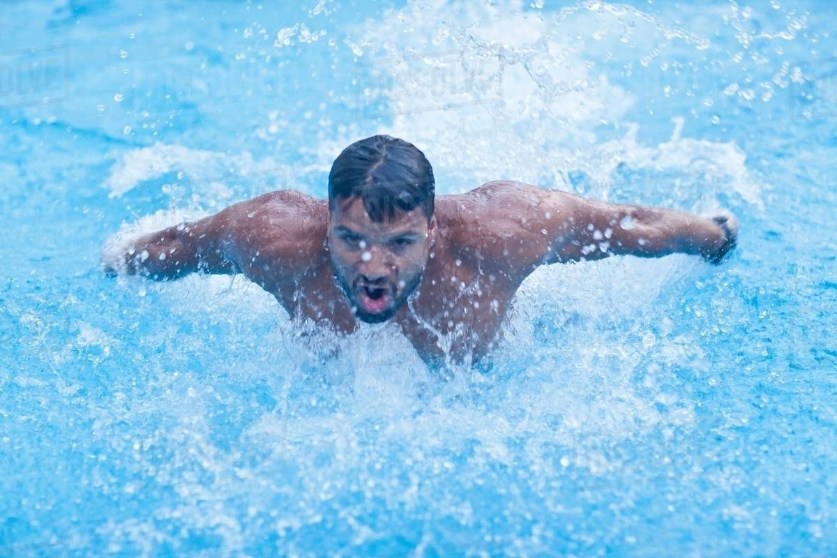 Man swimming in pool - Royalty-free Stock Photo | Dissolve