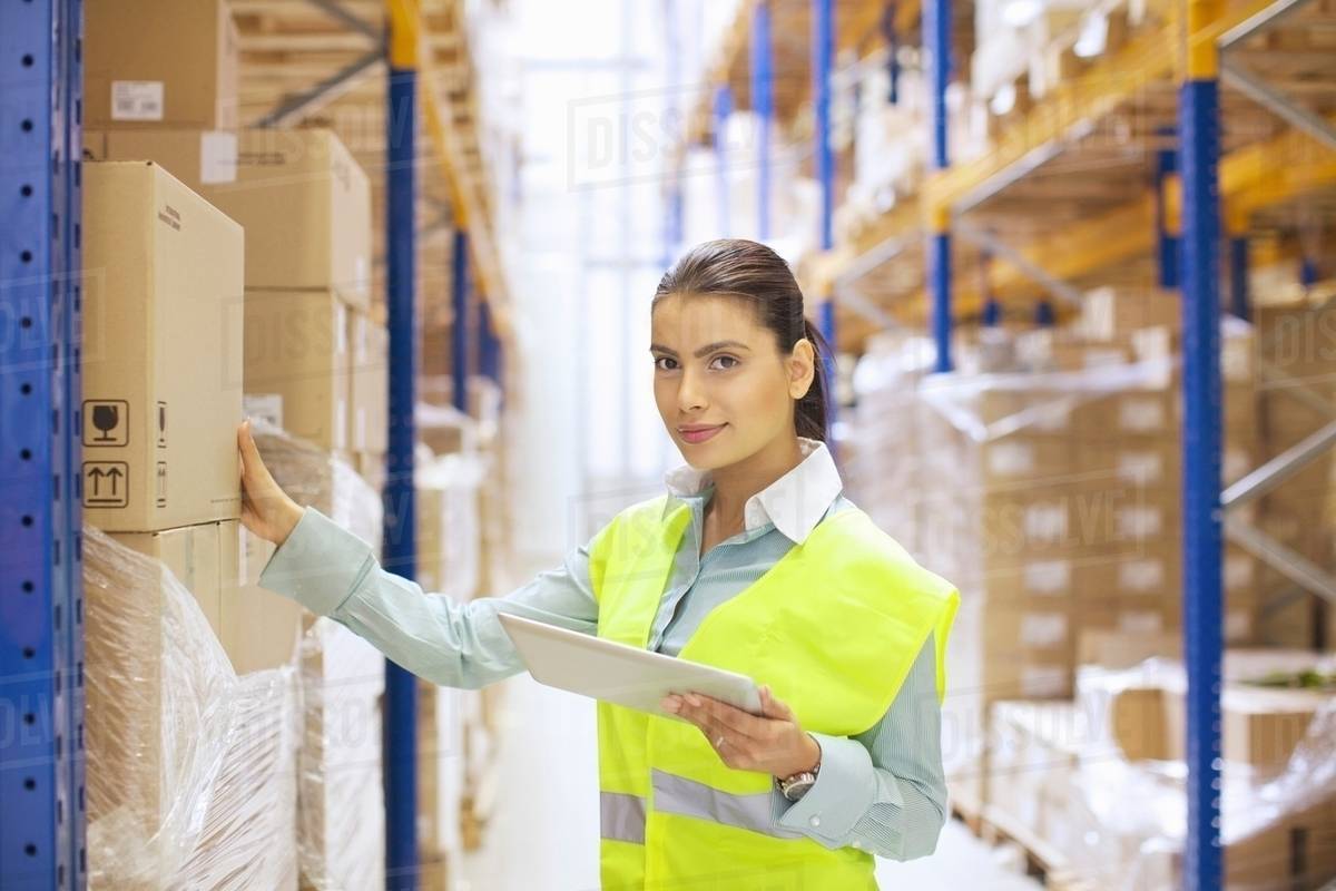 Female warehouse worker with digital tablet - Royalty-free Stock Photo ...