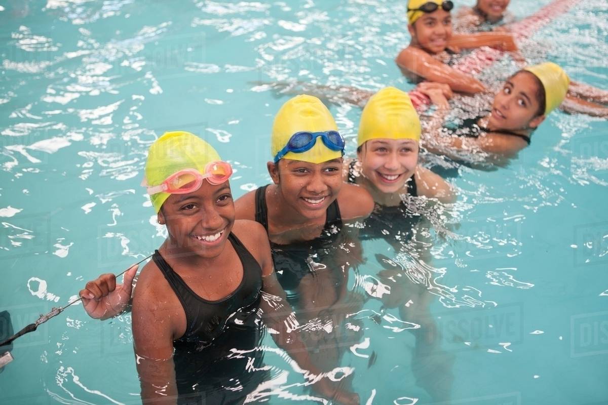 Group of schoolgirls taking a break in swimming pool - Royalty-free ...