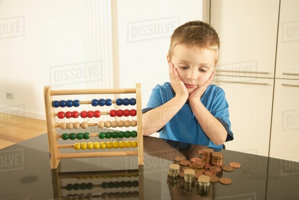 Boy looking at money - Royalty-free Stock Photo | Dissolve