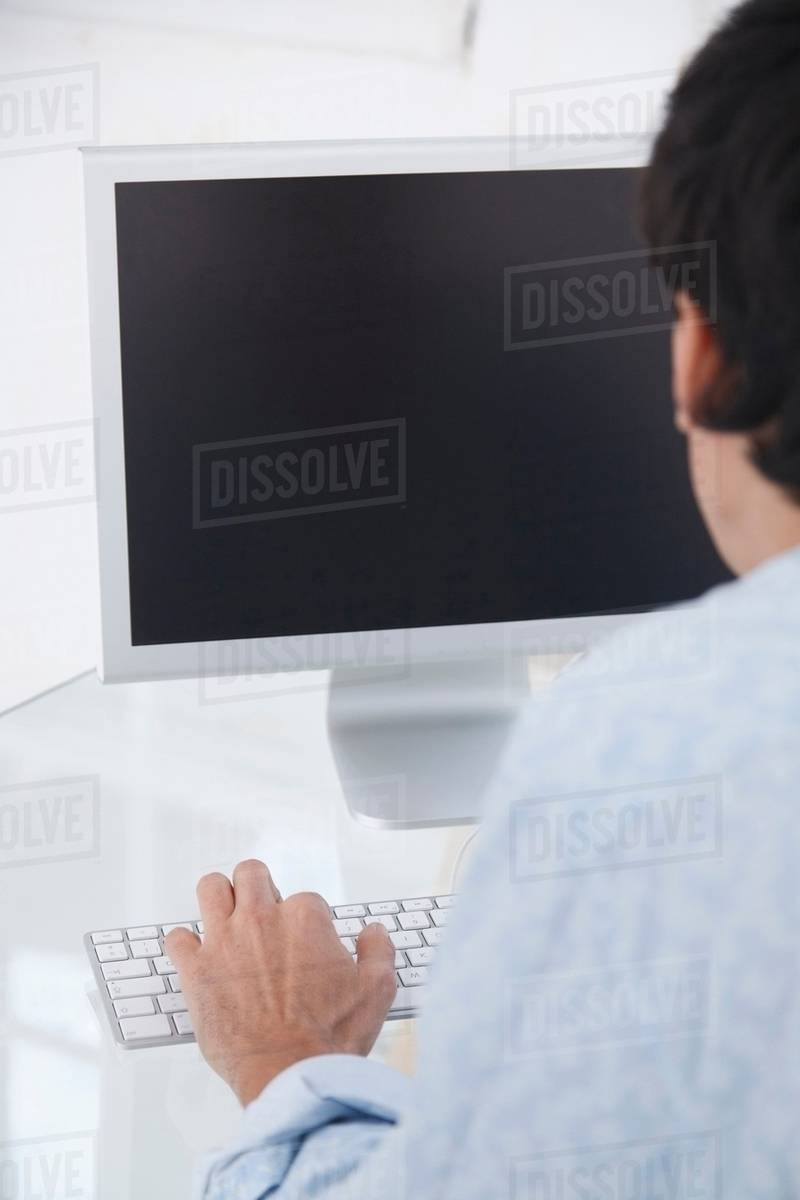 Blank computer screen , shot from over a mans shoulder - Stock Photo ...