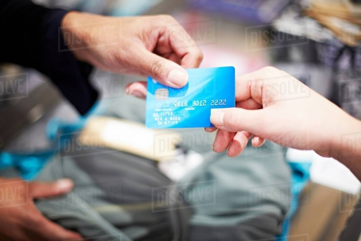 Paying with a card - Royalty-free Stock Photo | Dissolve