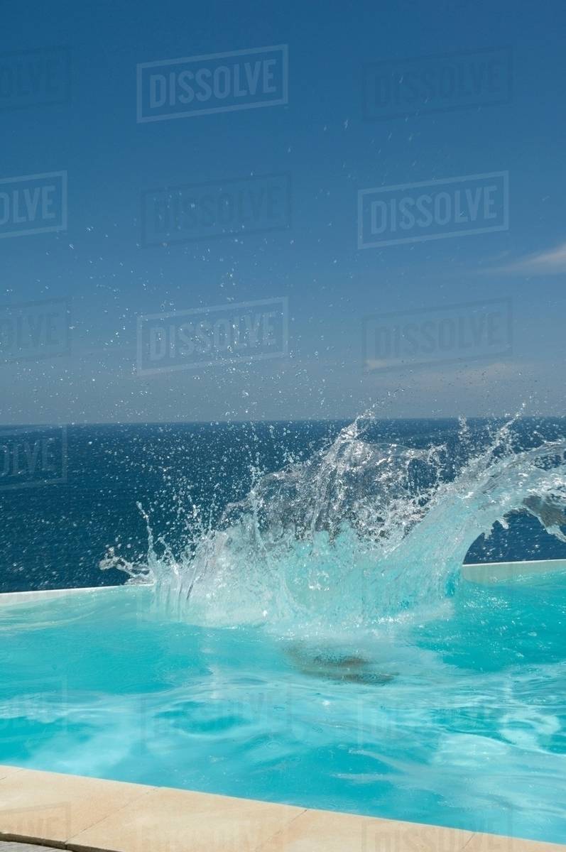 Splashing water in swimming pool - Royalty-free Stock Photo | Dissolve