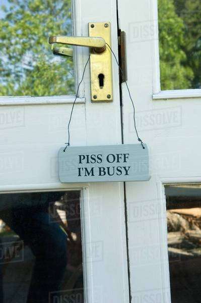 Busy sign on door - Royalty-free Stock Photo | Dissolve