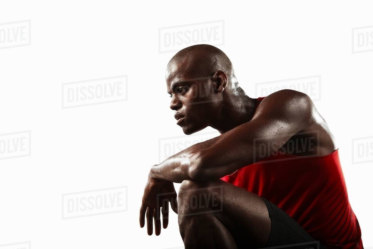 Athlete crouching - Stock Photo - Dissolve