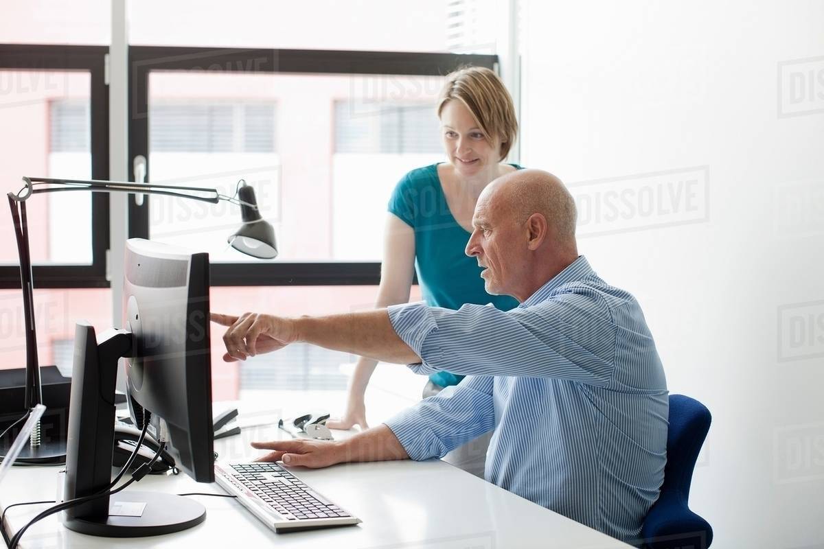 Business people using computer in office - Royalty-free Stock Photo ...