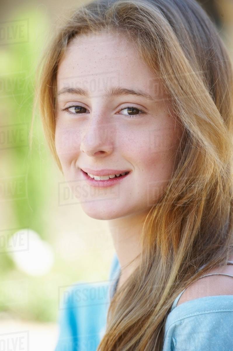 Close up of girl's smiling face - Stock Photo - Dissolve