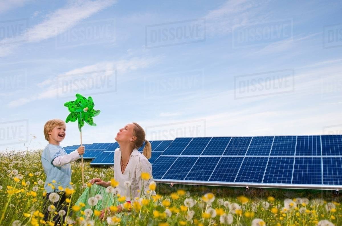 Mother and son with solar panels - Royalty-free Stock Photo | Dissolve