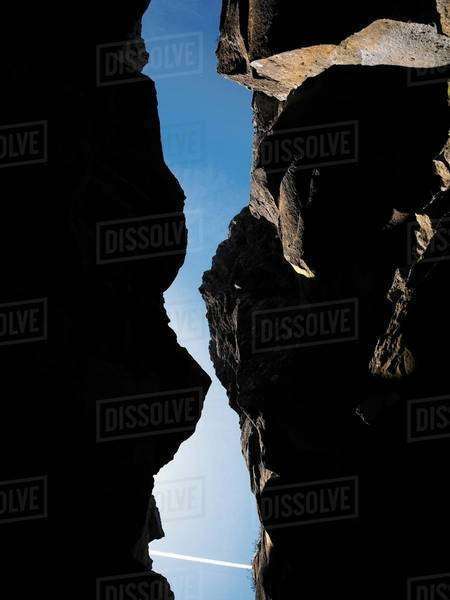 Crevice between steep rock faces - Stock Photo - Dissolve