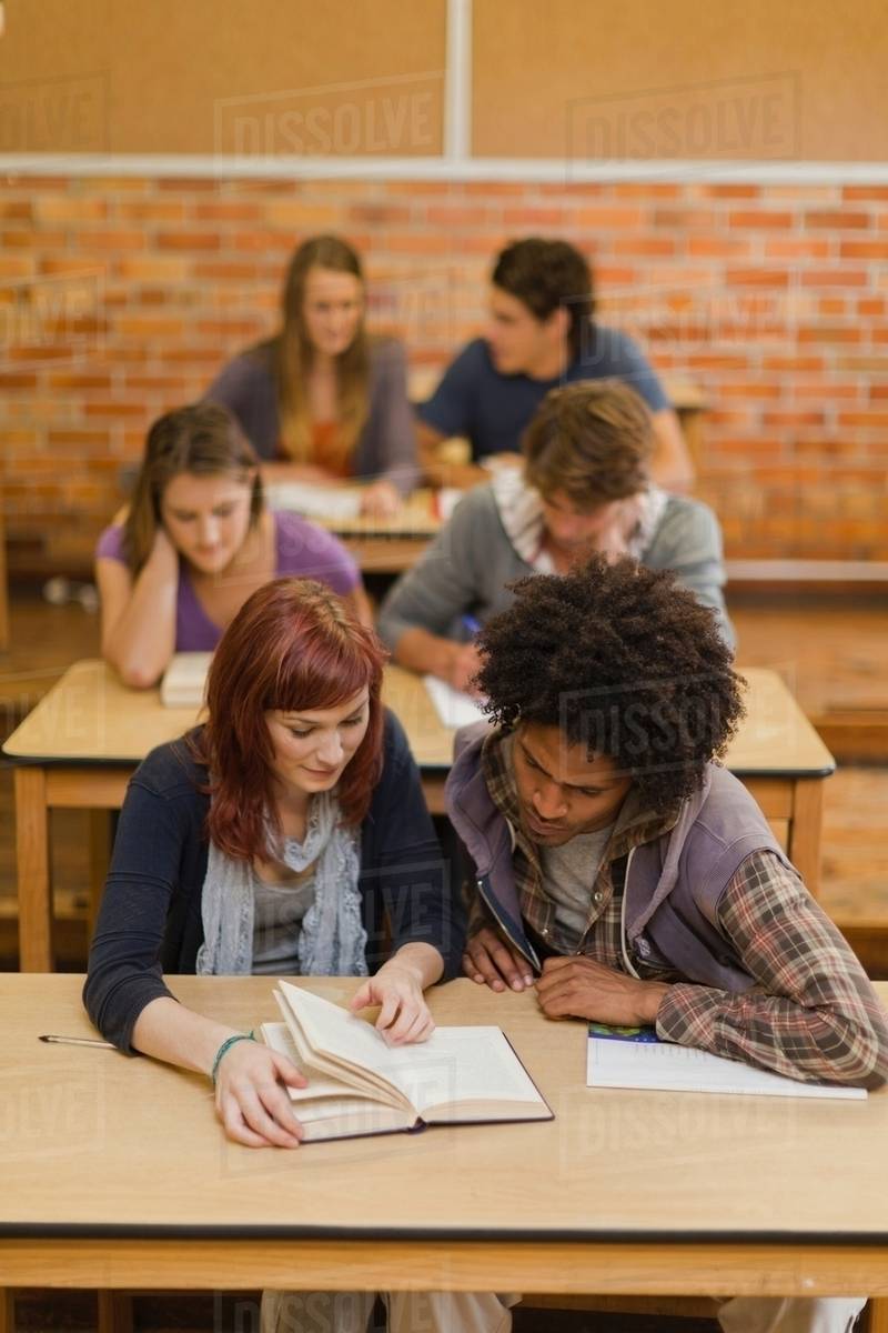 Students working together in class - Royalty-free Stock Photo | Dissolve