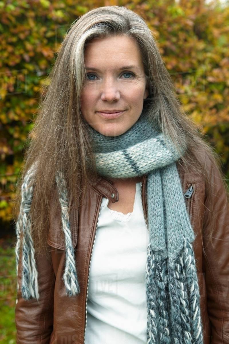 Older woman wearing scarf outdoors - Royalty-free Stock Photo | Dissolve