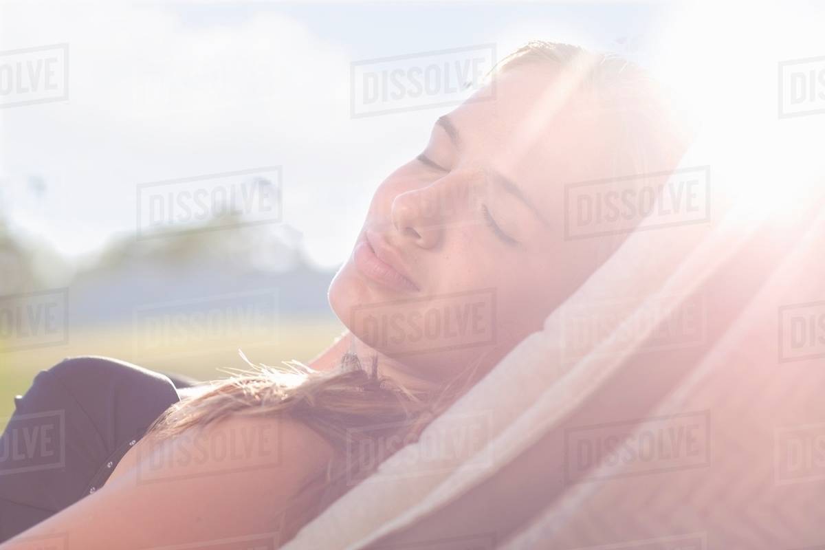Teenage girl sleeping in lawn chair - Royalty-free Stock Photo | Dissolve