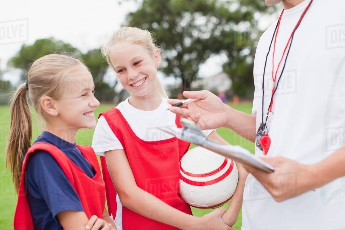 Coach talking to children on soccer team - Royalty-free Stock Photo ...