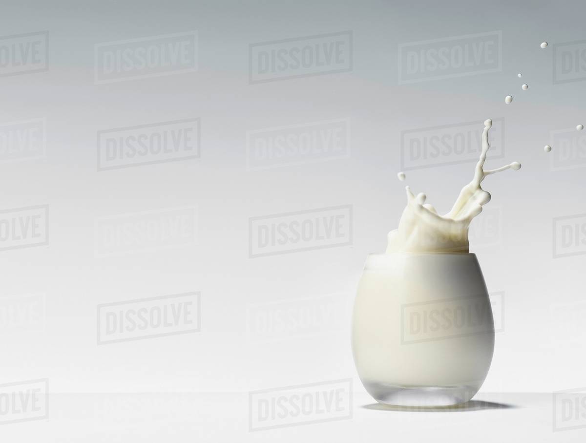 Close up of splashing milk - Royalty-free Stock Photo | Dissolve