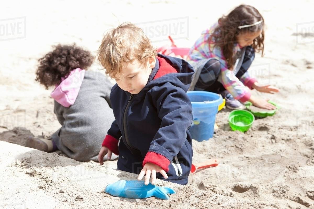 Children playing with sand in playground - Royalty-free Stock Photo ...