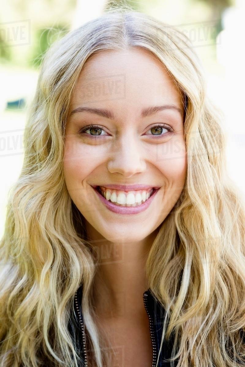 Close up of womans smiling face - Stock Photo - Dissolve