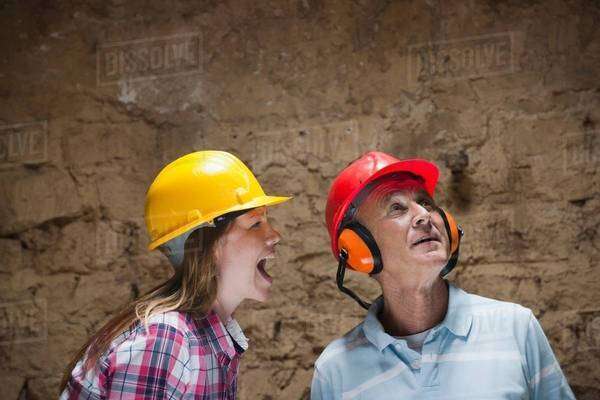 Construction worker yelling at colleague - Stock Photo - Dissolve