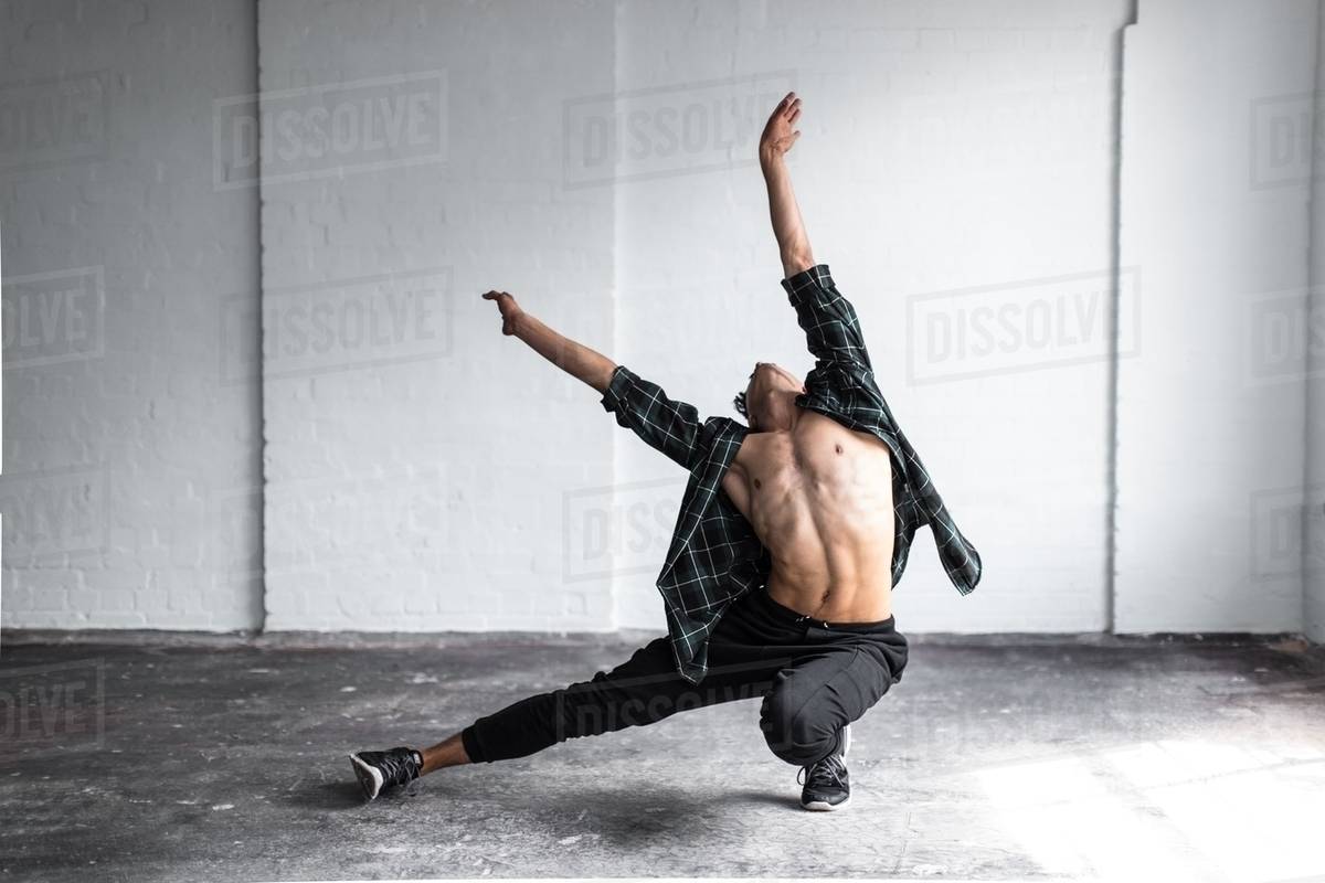 Dancer practising in studio - Royalty-free Stock Photo | Dissolve