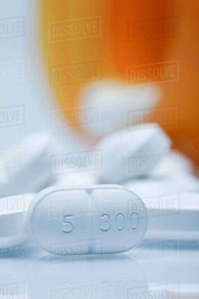 Close up of oval white pill, Vicodin - Royalty-free Stock Photo | Dissolve