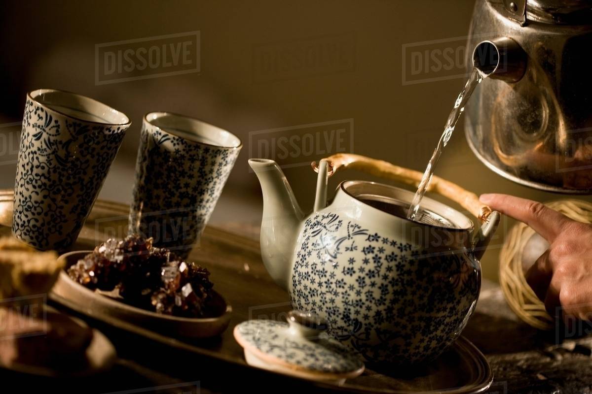 Preparing tea - Royalty-free Stock Photo | Dissolve