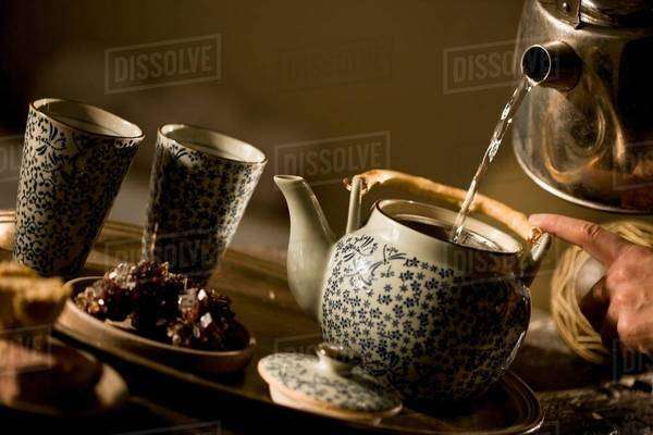 Preparing tea - Royalty-free Stock Photo | Dissolve