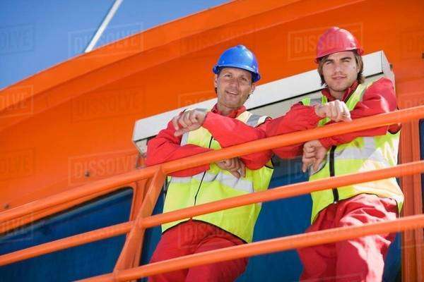 Worker on a floating bridge - Stock Photo - Dissolve