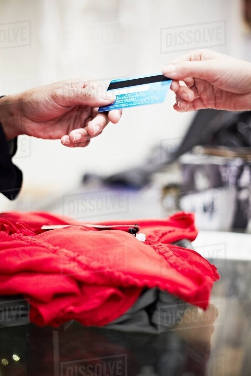 Paying with a card - Royalty-free Stock Photo | Dissolve