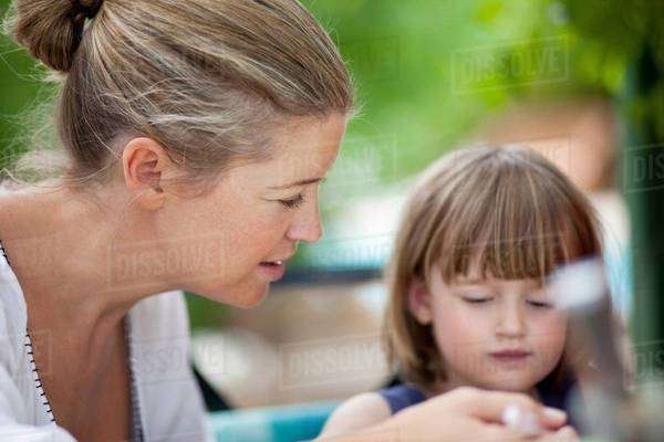 Mom teaching kid - Royalty-free Stock Photo | Dissolve
