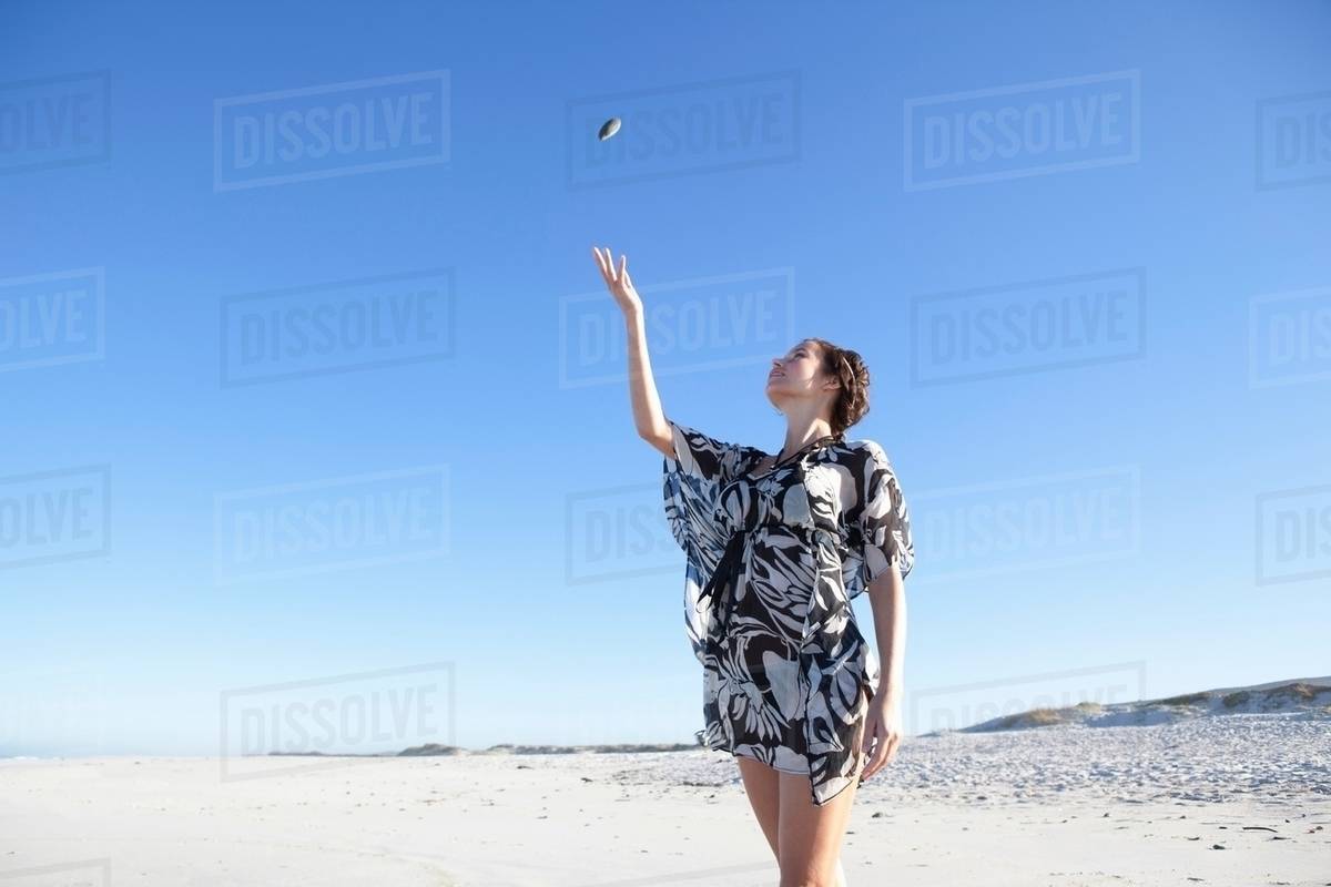 Girl throwing stone - Stock Photo - Dissolve