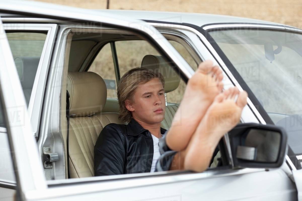 Boy chilling in the car - Stock Photo - Dissolve