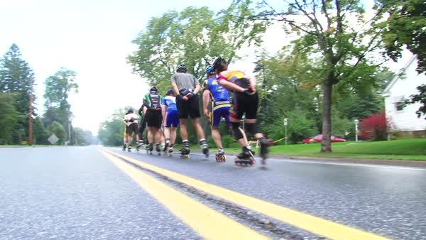 Inline skaters racing and passing by camera in marathon. - Stock Video ...