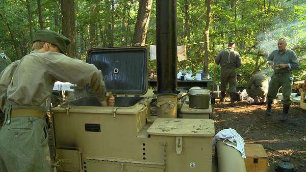 A soldier stirs a hearty breakfast in an authentic German field kitchen ...