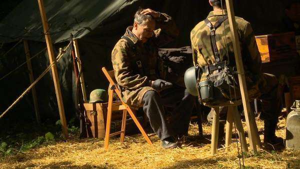Two German Luftwaffe field division soldiers of World War II relax next ...