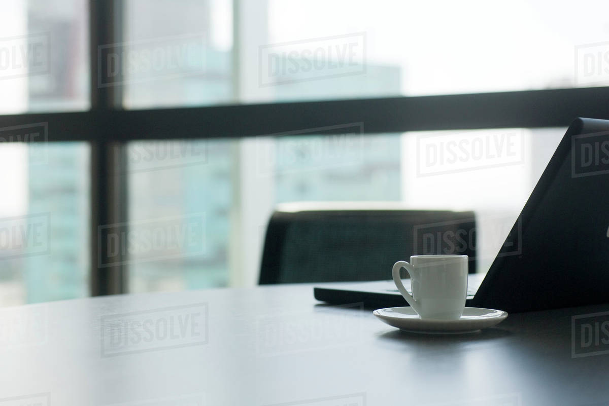 Laptop computer and coffee cup and saucer - Royalty-free Stock Photo ...