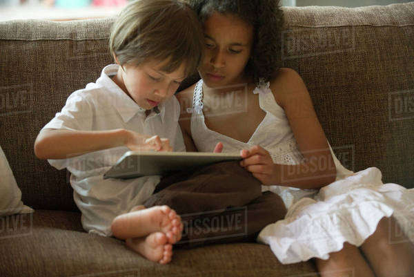 Children using digital tablet - Royalty-free Stock Photo | Dissolve