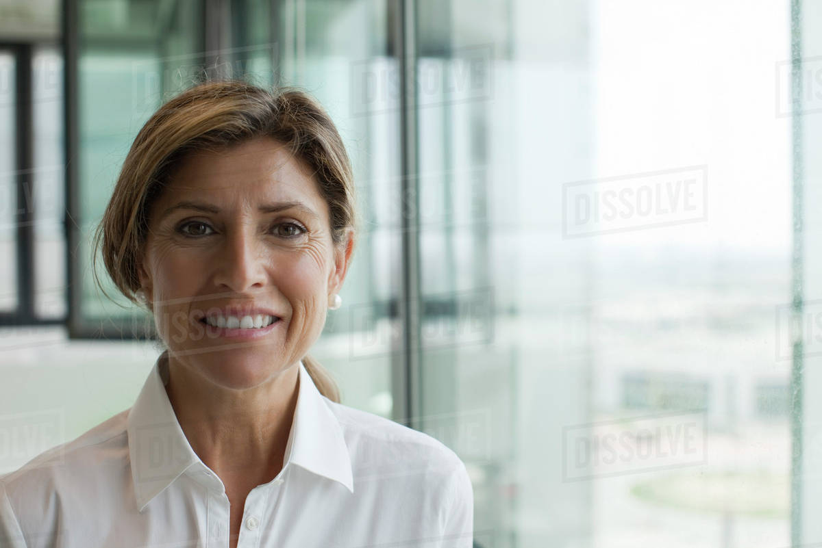 Professional woman smiling - Royalty-free Stock Photo | Dissolve