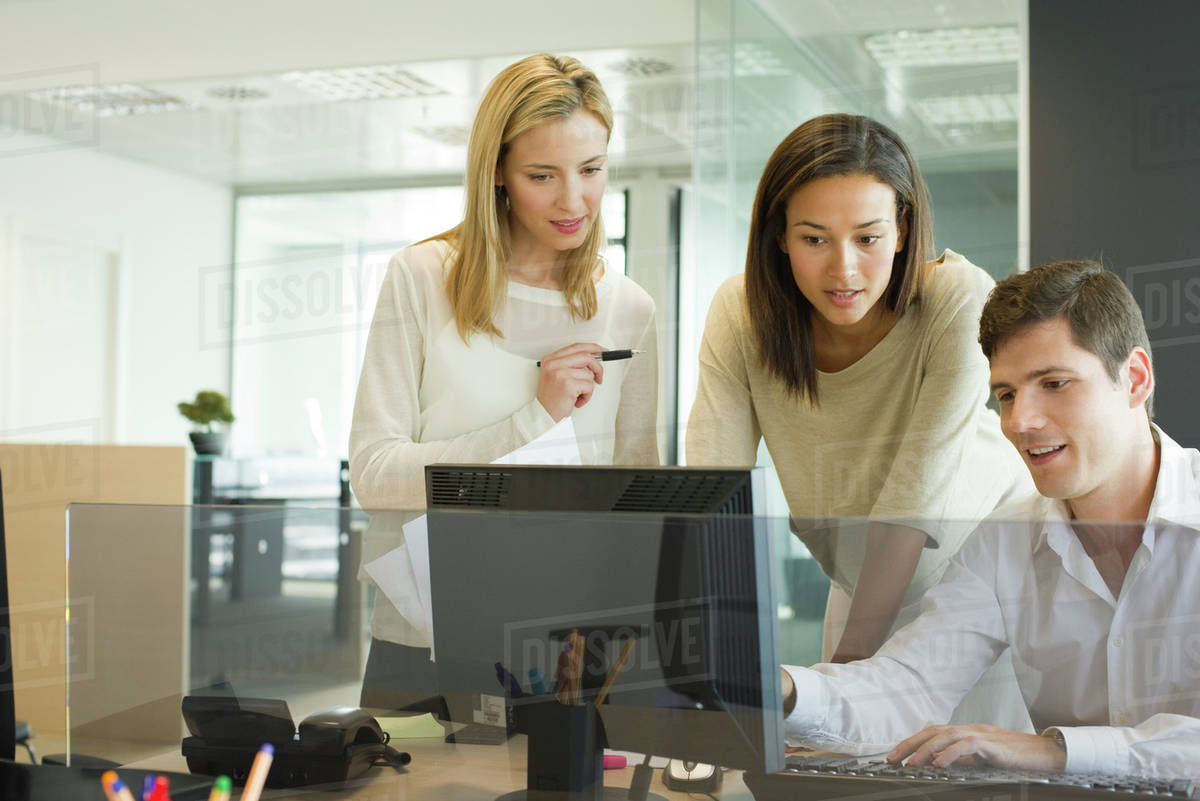 Colleagues working together at computer - Royalty-free Stock Photo ...