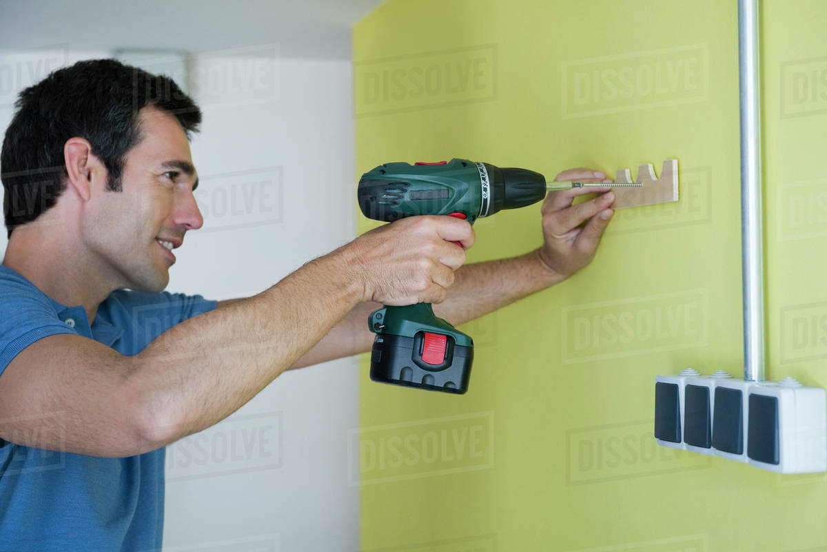 Man using power drill - Royalty-free Stock Photo | Dissolve