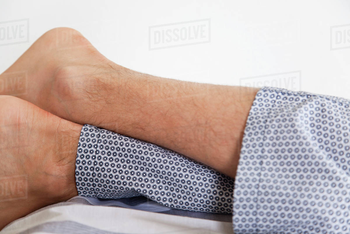 Man's leg's crossed at ankle - Royalty-free Stock Photo | Dissolve
